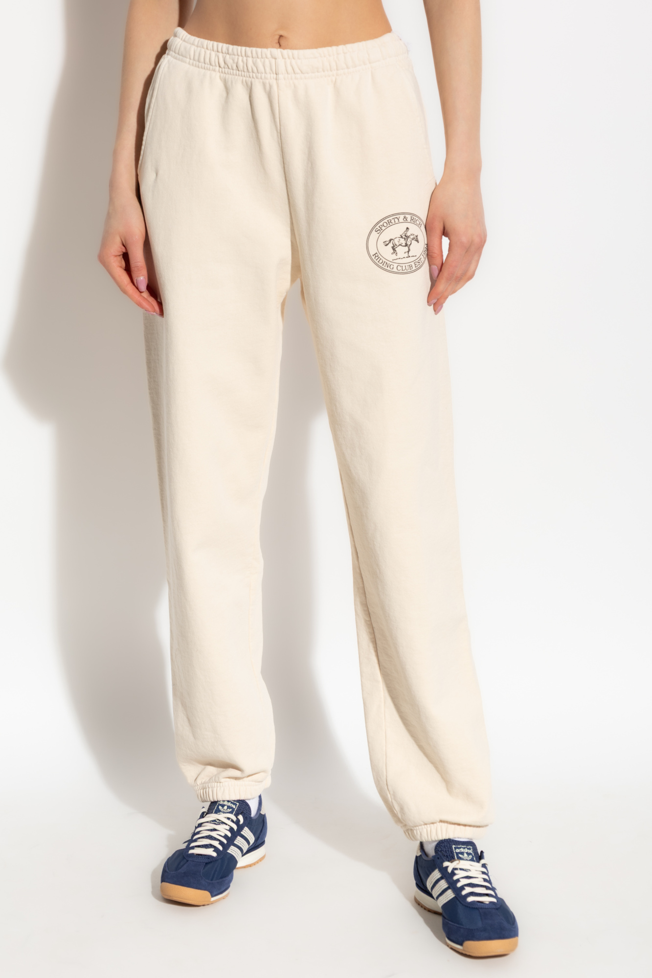 Cream Tracksuit bottoms from the Riding Drop collection Sporty & Rich ...